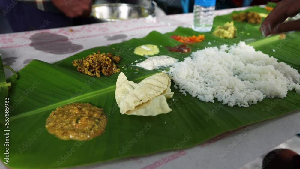 People eating traditional Indian wedding marriage sadhya rice Sambar ...