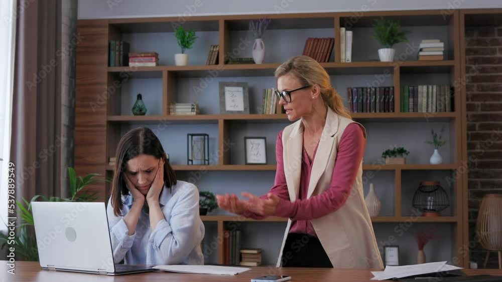 Angry female boss screaming at scared office worker. Demanding manager ...