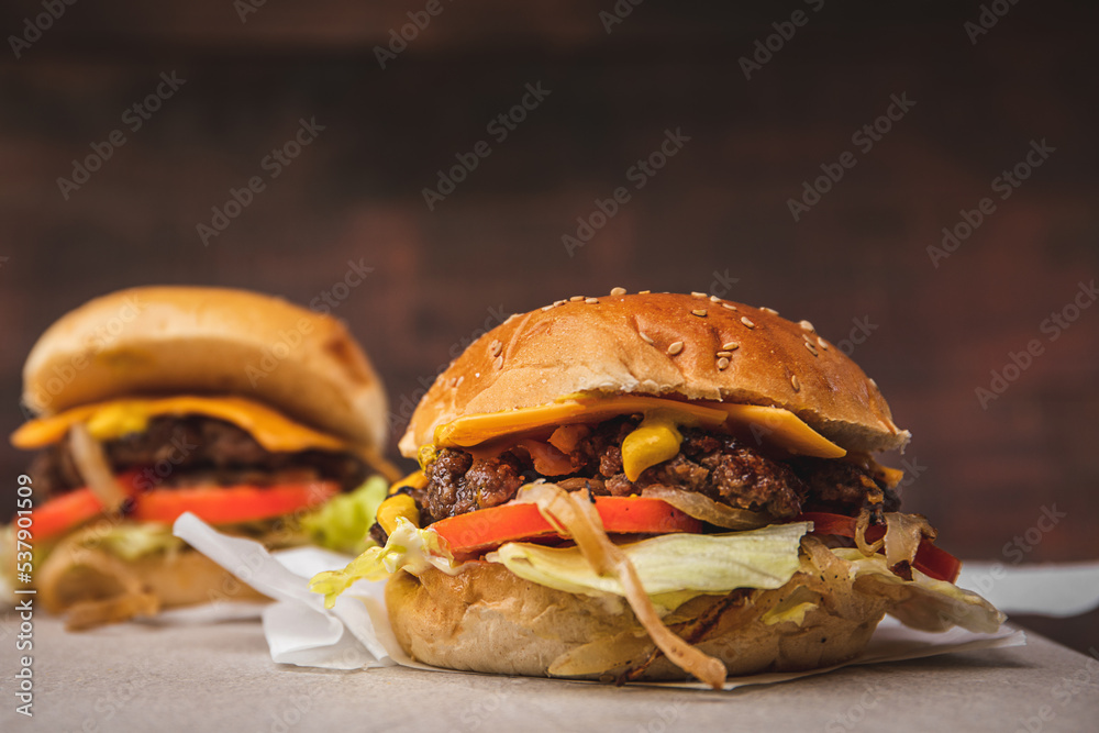 Traditional American smash burger with cheddar cheese, tomato, grilled ...