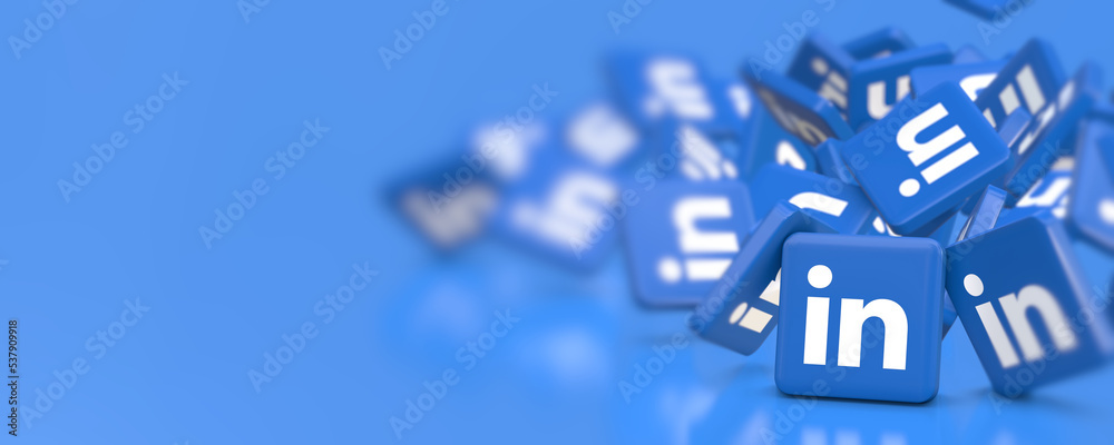 LinkedIn logos fall on a table. Banner format with copy space and ...