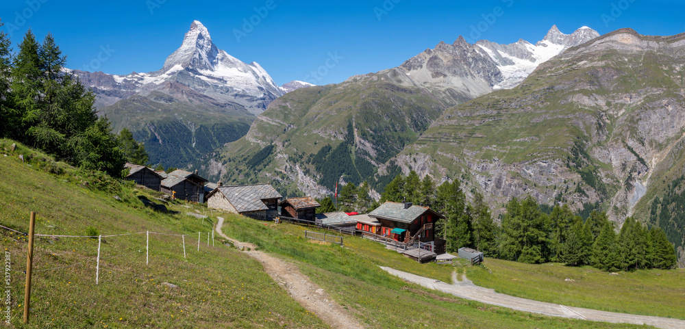 The panorama of swiss walliser alps with the Matterhorn peak with the ...