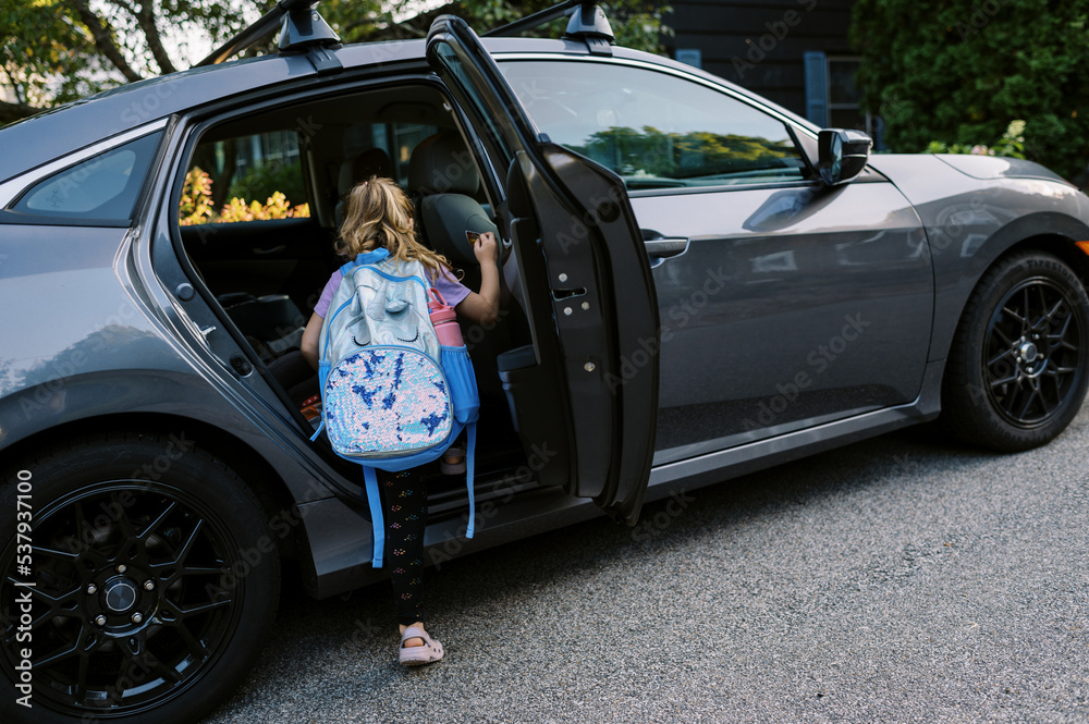 Little girl getting ready to leave for school by car Stock Photo ...