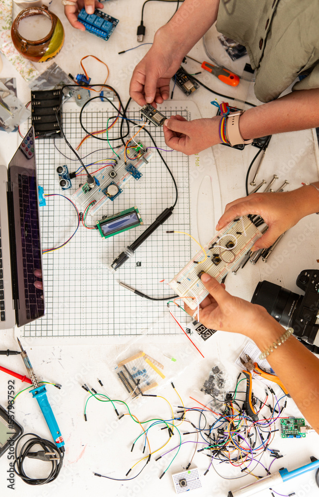 Coworkers making Arduino circuits Stock Photo | Adobe Stock