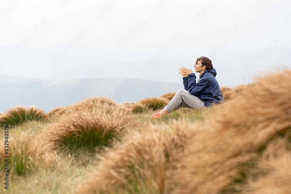 Beautiful woman is posing on nature background Stock Photo | Adobe Stock