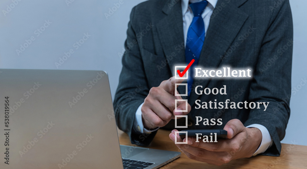 Feedback. business man hand checking mark on checklist box on mobile ...