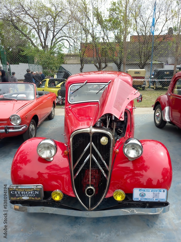 old red elegant 1946 Citroen Traction Avant Legere in a park. Front ...