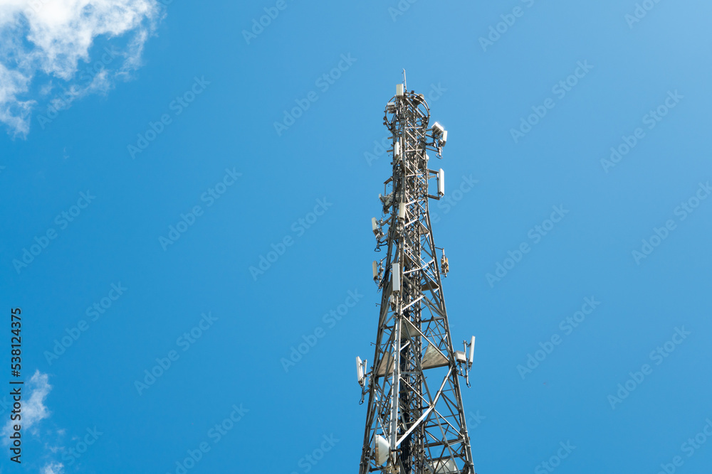 Cell tower. Cellular base station, mobile phone antenna. Blue ...