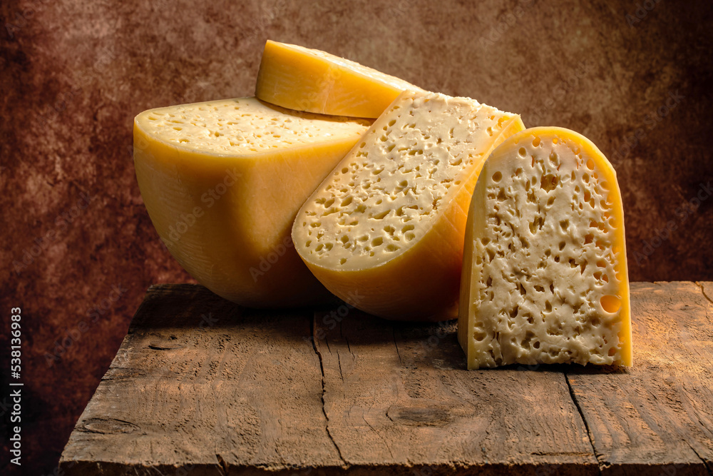 Fotografia do Stock: Emmental cheese triangle, Swiss cheese. piece of ...