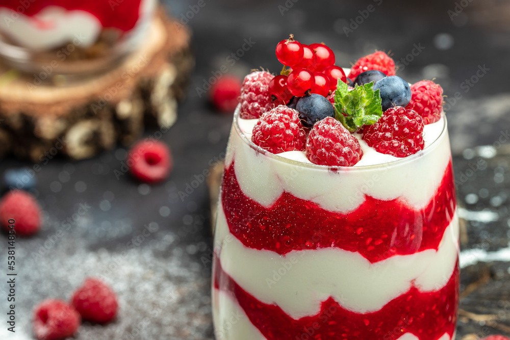 Scottish dessert whipped cream, roasted oatmeal and raspberries in jar ...