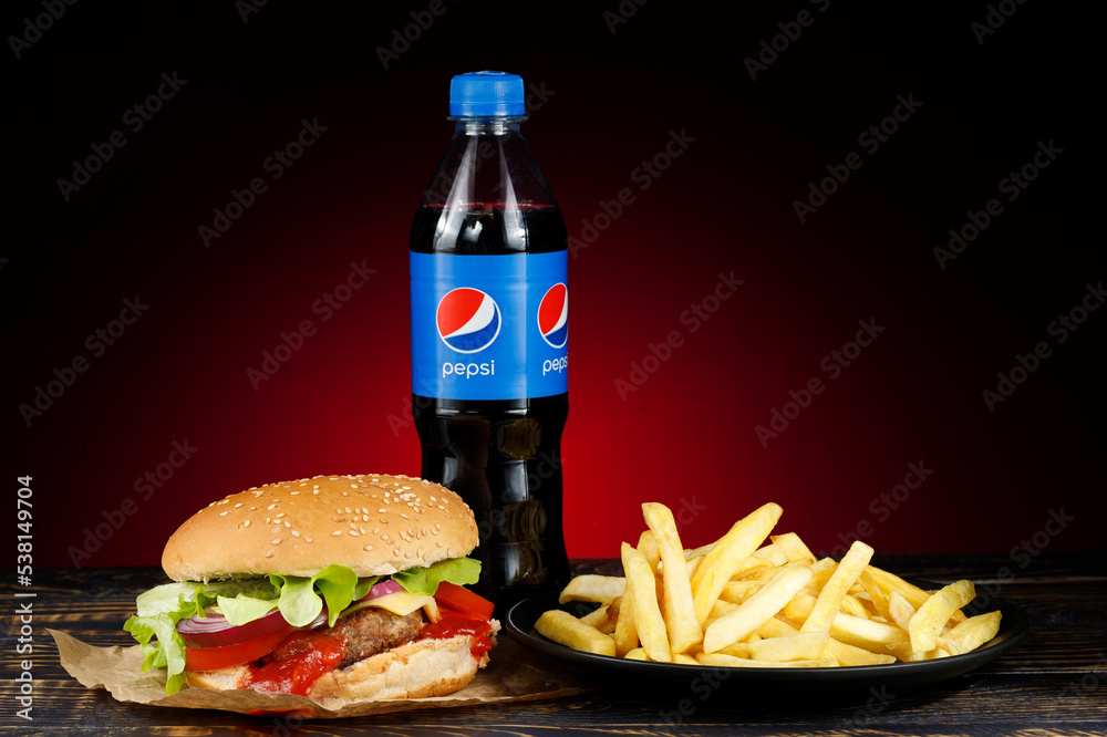 LVIV, UKRAINE - September 30, 2022: Burger and Pepsi cola with fries ...