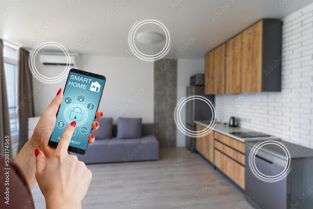 Smart home technology interface on smartphone app screen with augmented ...