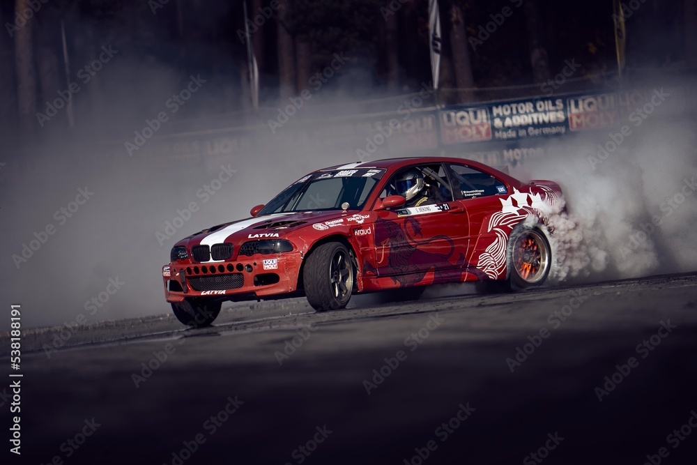 11-05-2022 Riga, Latvia a red car with smoke coming out of it, a red ...