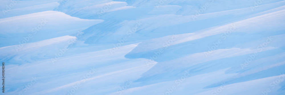 Snow texture. Wind sculpted patterns on snow surface. Wind in the ...