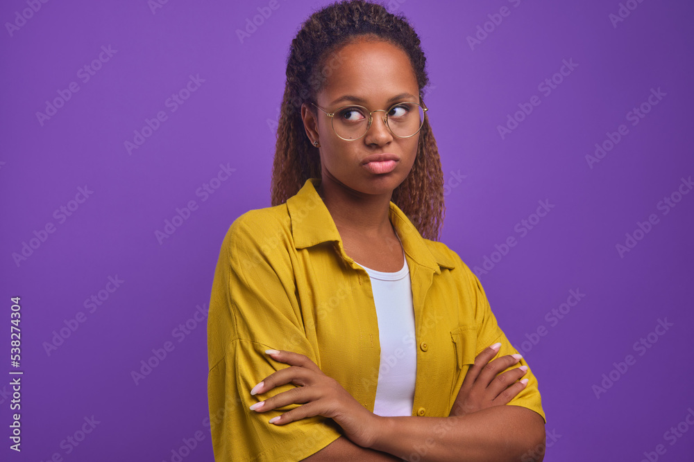 Young Offended African American Woman Pouts Lips And Turns Away To Show