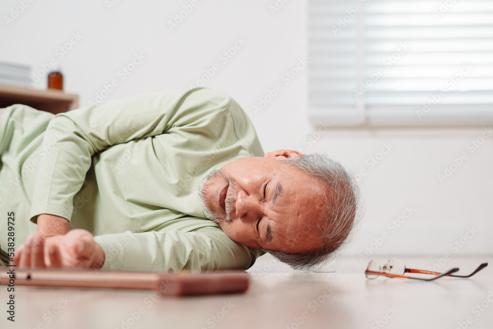Asian senior man falling on the ground with walker in living room at ...