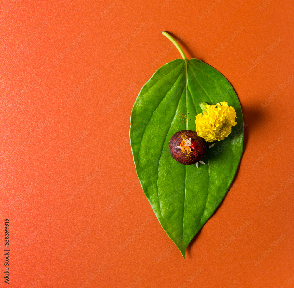 Betel nut and betel leaf placed in pooja and worshiped as a symbolic ...