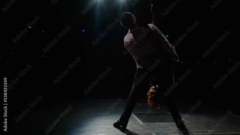 360-degree camera flyby around dance couple standing in inverted ...