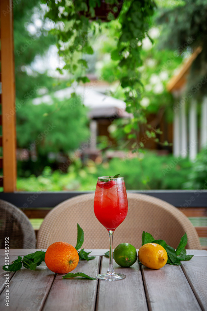 Prosecco with Rossini strawberry puree. Alcoholic italian cocktail with ...