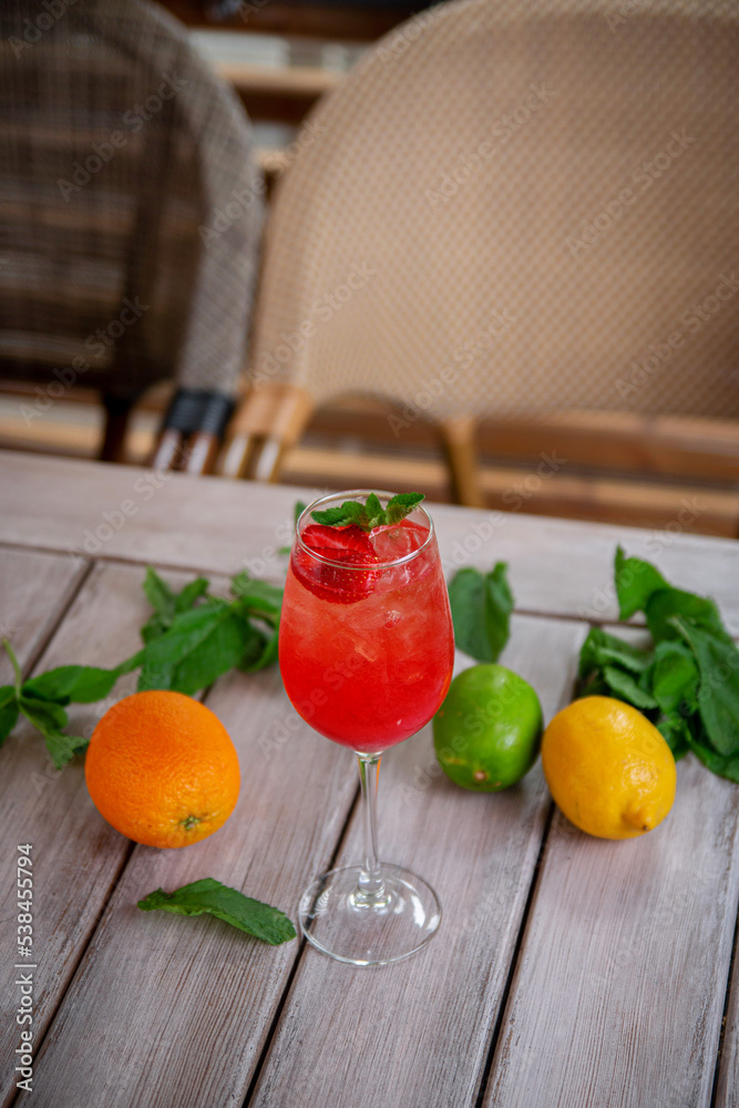 Prosecco with Rossini strawberry puree. Alcoholic italian cocktail with ...