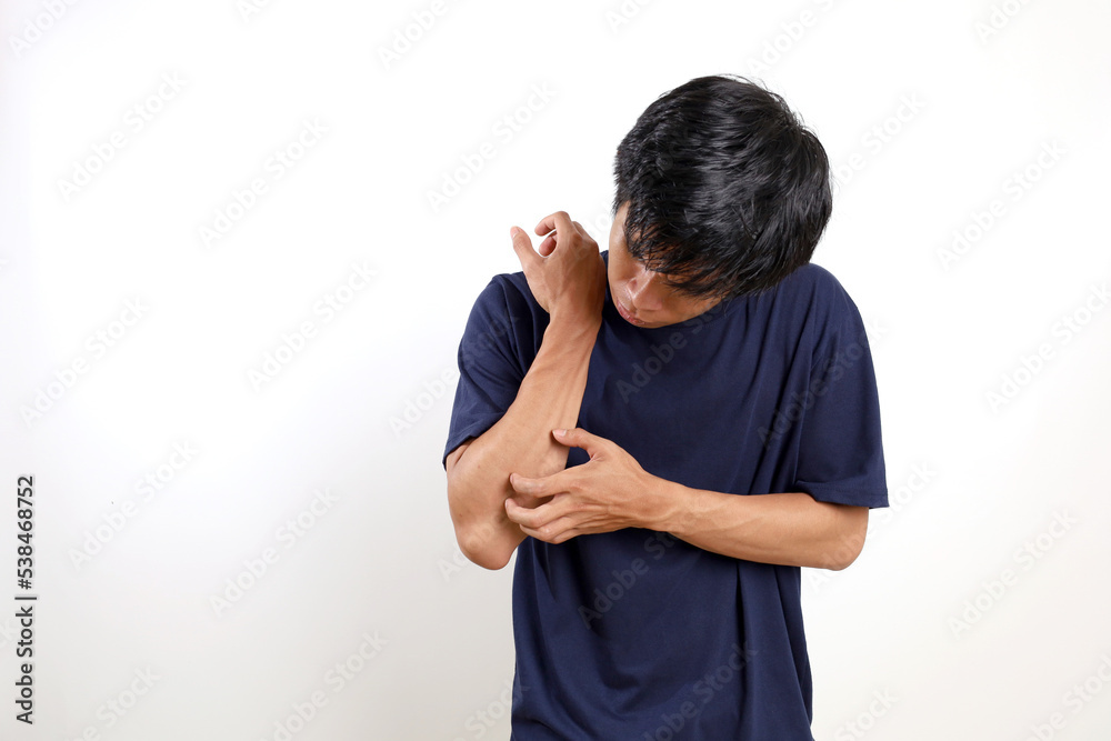 Young asian man standing, scratching and feeling itchy. Itchy skin ...