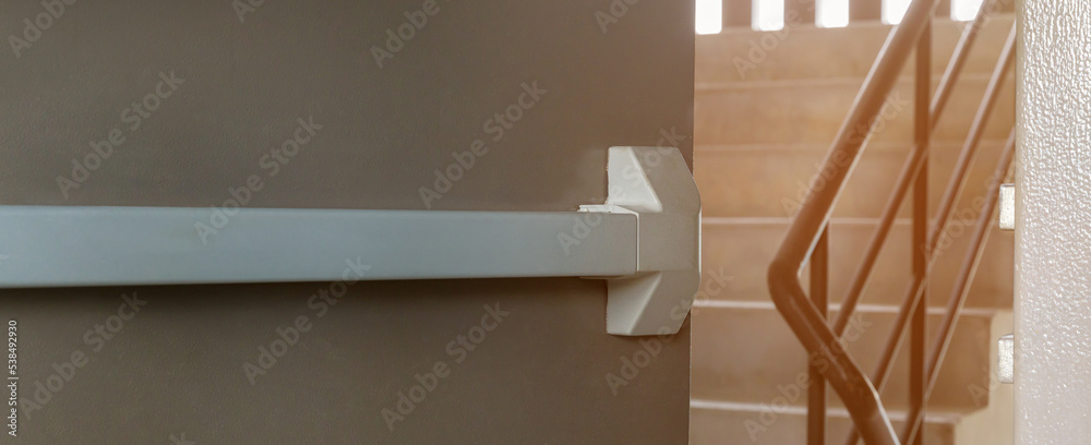 Emergency fire exit door. Closed up latch and rusty door handle of ...
