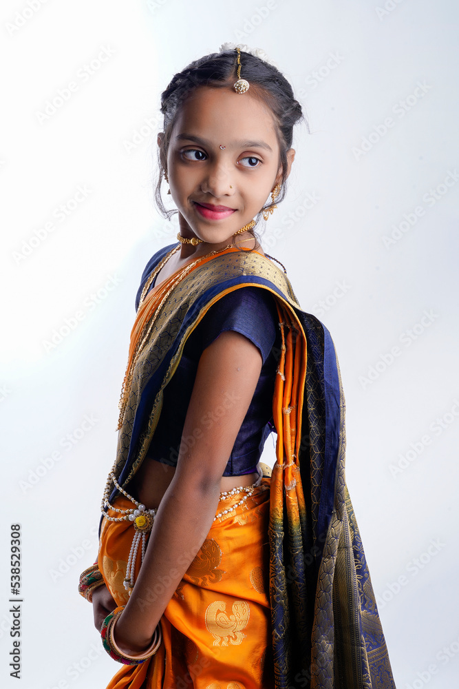 indian marathi little girl in traditional blue navwari saree on white ...
