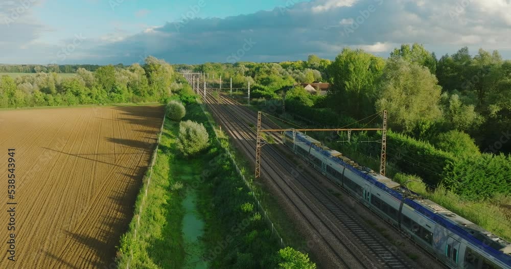 Country travel by high-speed train. Aerial view of fast passenger train ...