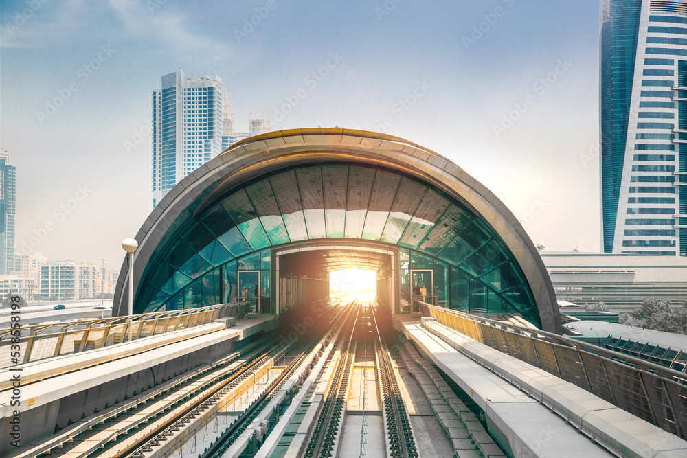 Dubai, UAE. Train, tube track with train station and City view at the ...