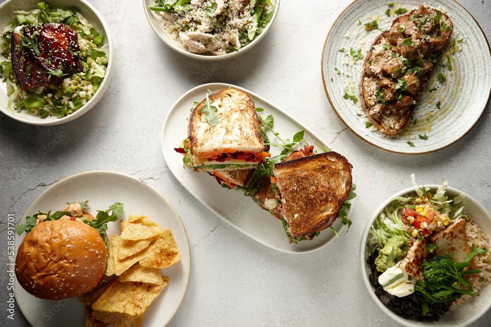 Overhead shot of various lunch dishes Stock Photo | Adobe Stock