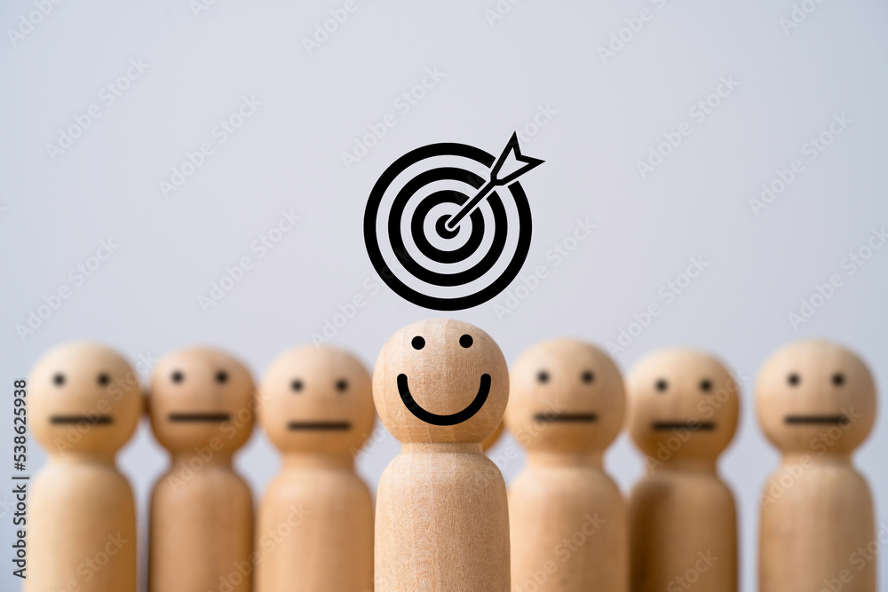 Smile face of leader wooden figure standing in front of staff wooden ...