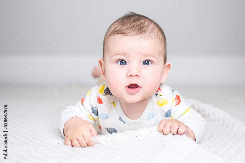 baby in prone position facing forward Stock Photo | Adobe Stock