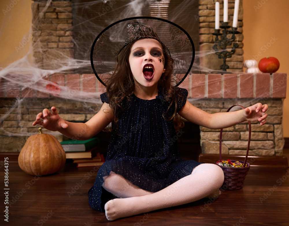 Gothic mysterious little girl enchantress, sorceress wearing a black ...