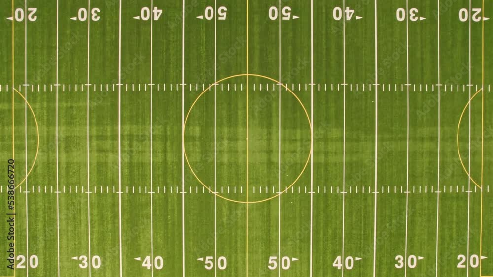 Rugby field grass zooms in view. Football field with green grass and ...