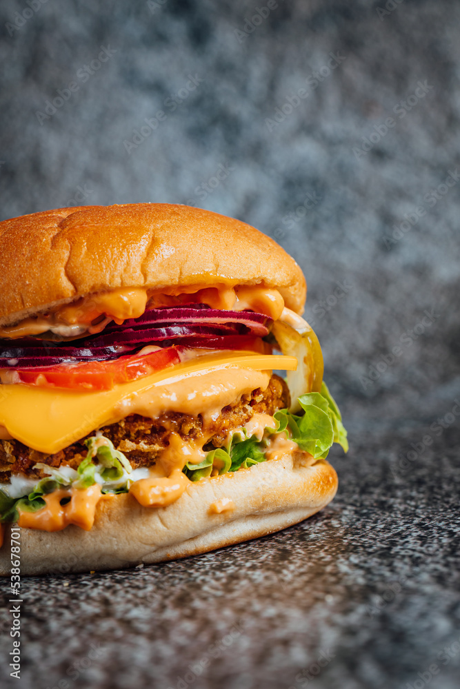 Fresh and juicy double beef cheeseburger with melted cheese on dark ...