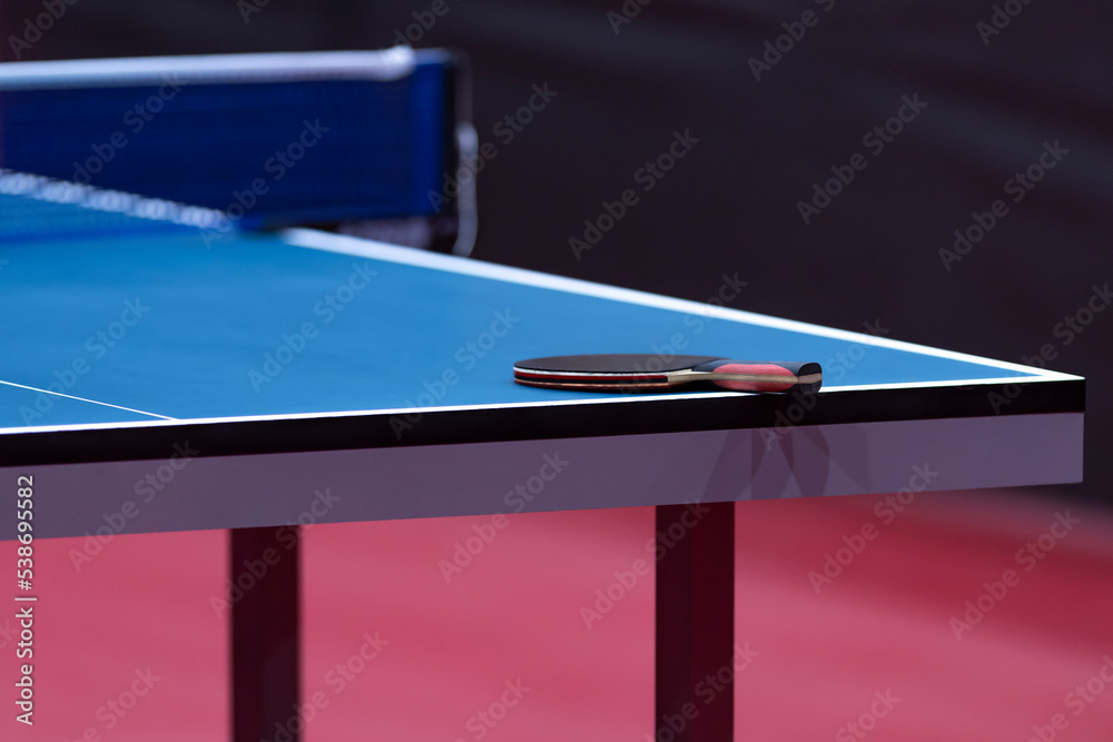 Professional blue table tennis table and racket. Horizontal sport theme ...