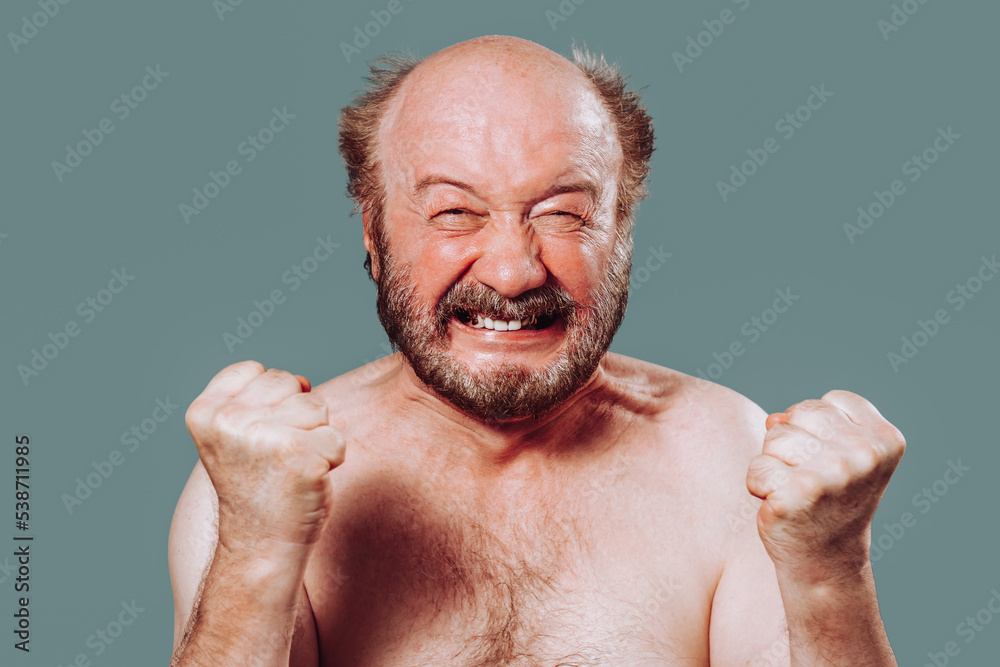 Portrait of a man aged front view looking at camera clenched teeth ...
