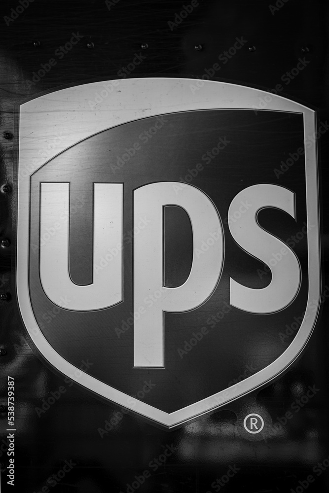 UPS logo on a wall. United Parcel Service is the world's largest ...