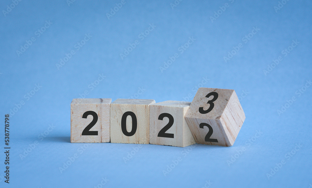 2022 changed to New Year 2023 on wood block. Welcome new year 2023 ...