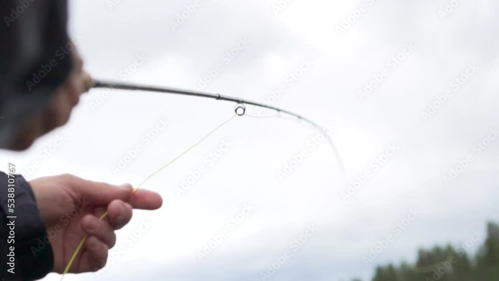 Male swinging his fly fishing rod in slow motion. Hunting, nature ...