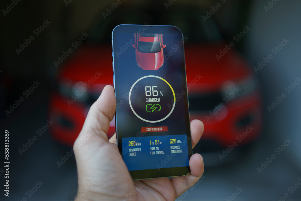 Using mobile smartphone device refueling electric vehicle EV car mock ...