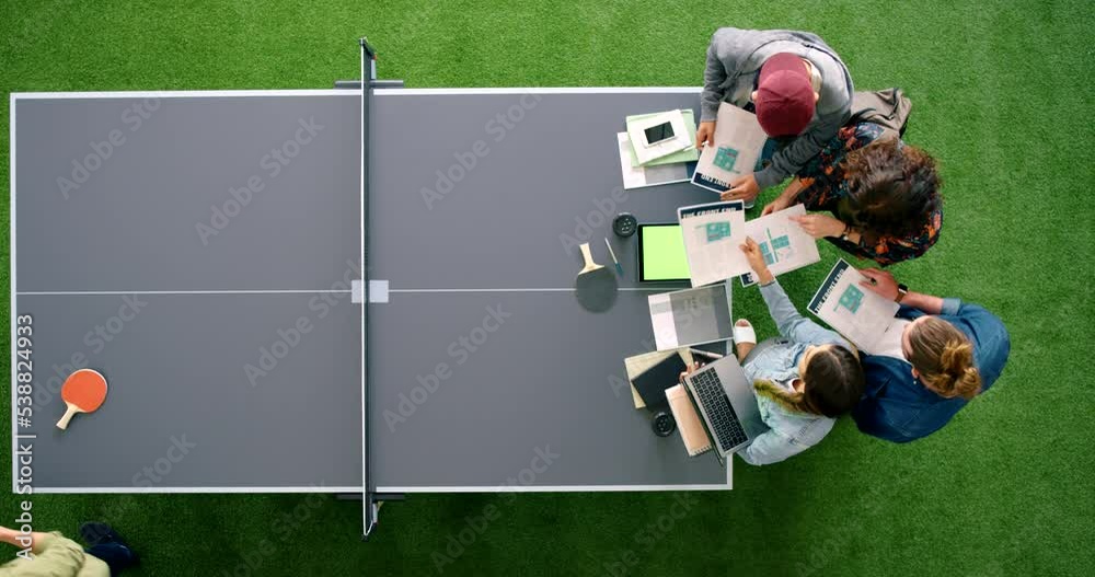 Top view, tablet or documents collaboration in modern office, table tennis turf or digital ...