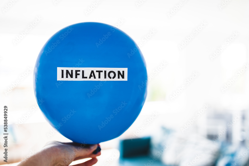 inflation text on top of big inflated balloon, the post-pandemic ...