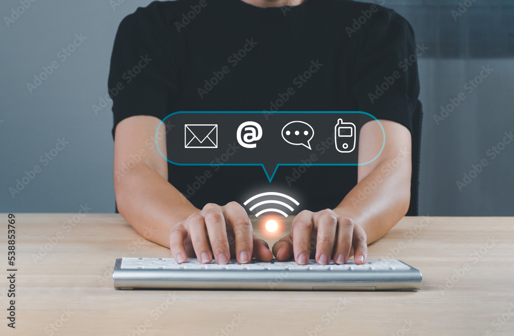 Businesswoman using computer keyboard with the email, call phone ...