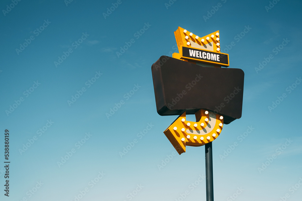Welcome black copy space frame sign with a yellow arrow with light ...