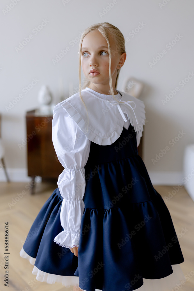 Child model posing at camera in stylish clothes Stock Photo | Adobe Stock