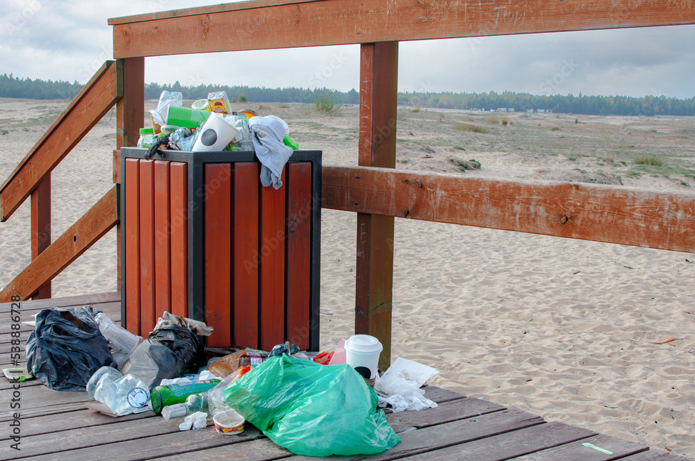 Rubbish overflow outside trash containers and poor waste management in ...