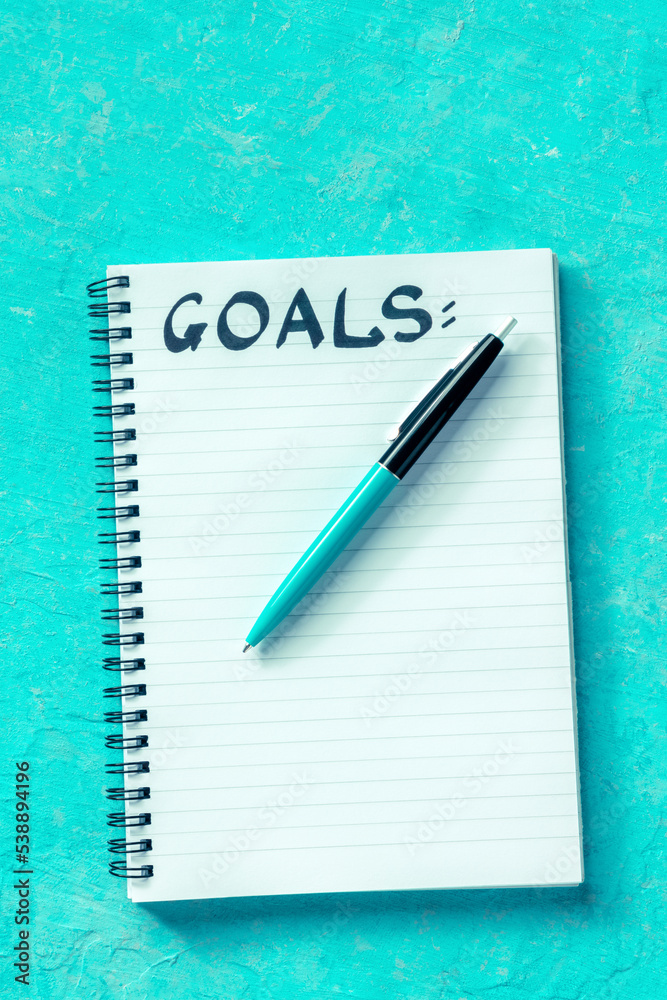 Goal Setting. Handwritten word Goals with a ballpoint pen and a notepad ...