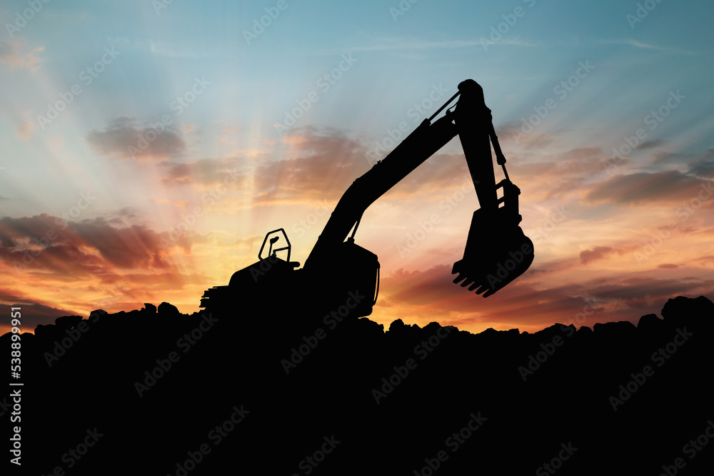 Crawler excavators silhouette are digging the soil in the construction ...