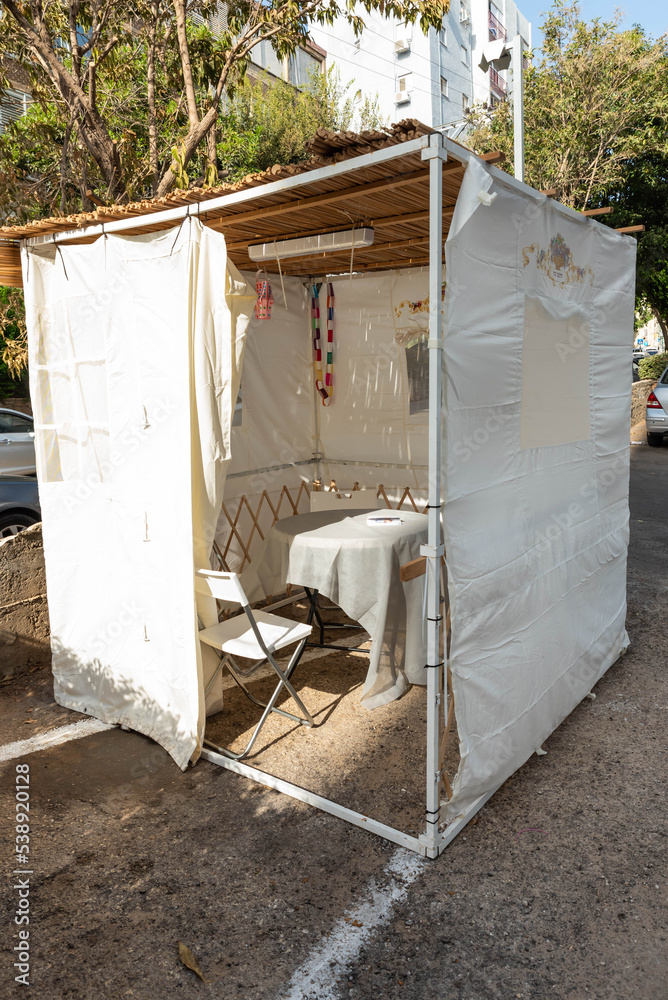 Jewish festival of Sukkot in Israel. Traditional sukkah with handmade ...