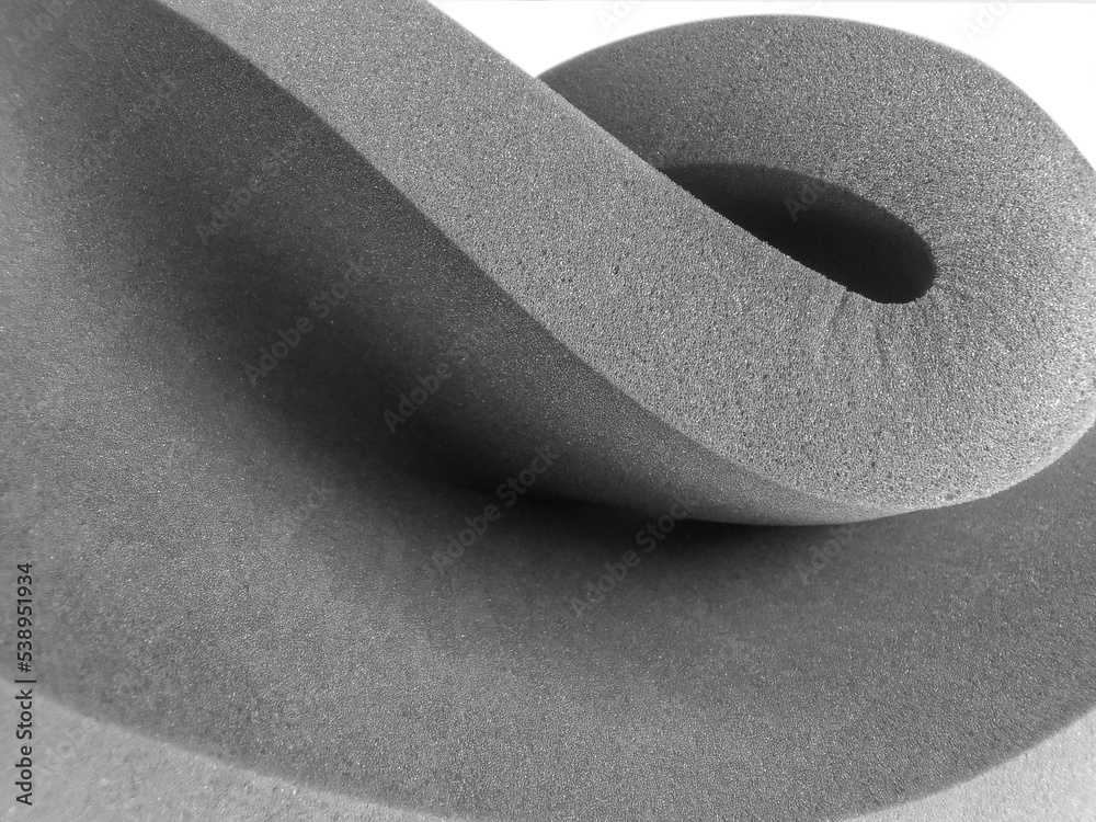 thick black sponge foam texture. curved sheet isolated on a white ...
